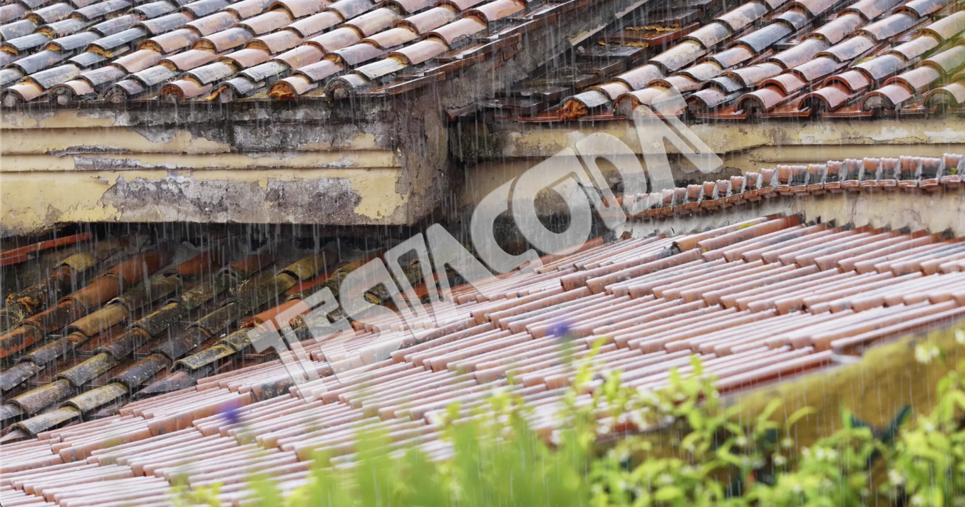 Pouring rain on tiles and gutters of a city roof (w/ sound) - Testacoda snc